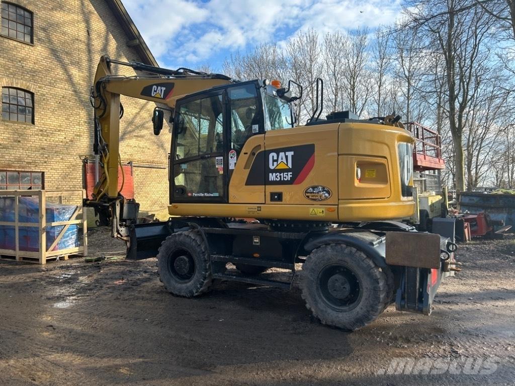 Caterpillar M315, 2021 - używane koparki kołowe - Mascus Polska